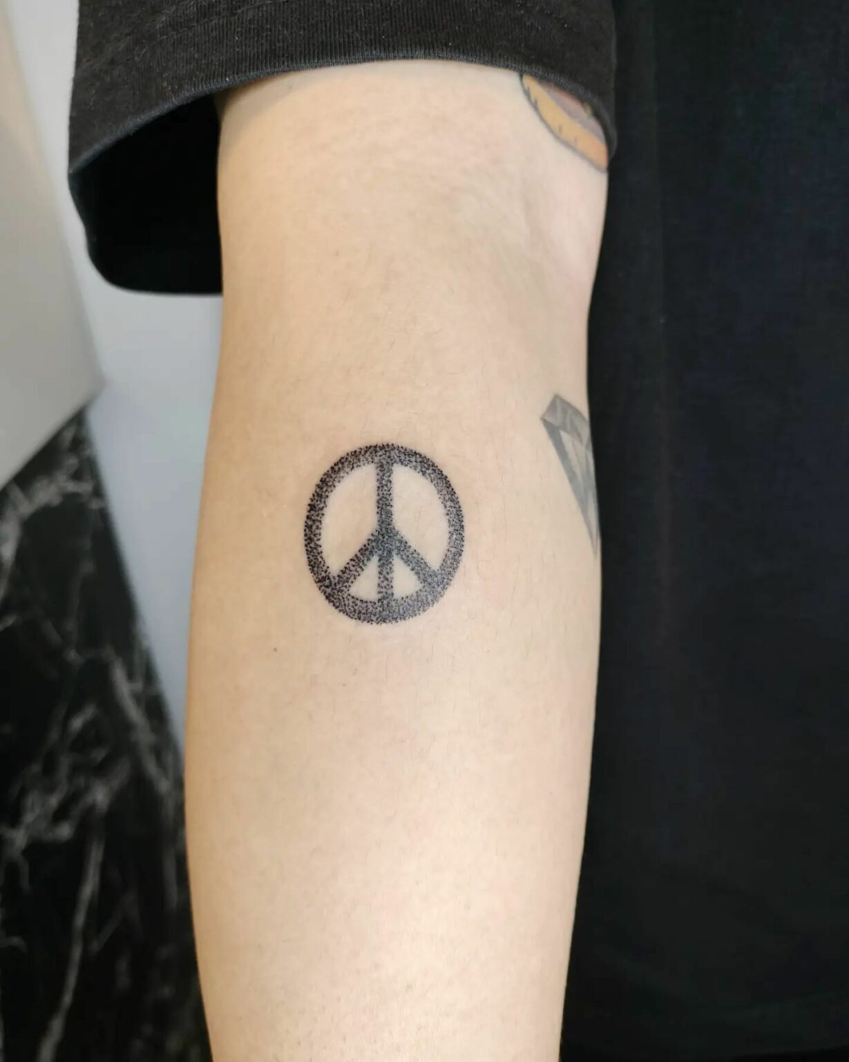 Amazing Peace Sign Tattoo Ideas To Inspire You in 2024